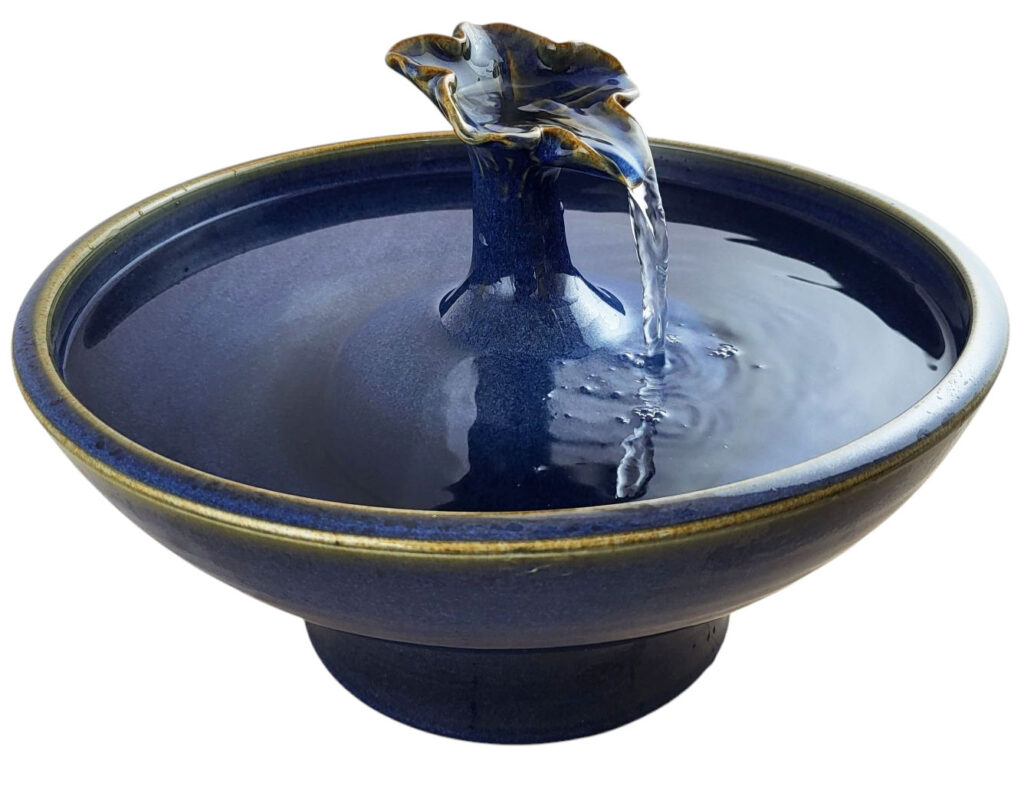 A beautiful cat water fountain with a raised drinking area for longhair ...