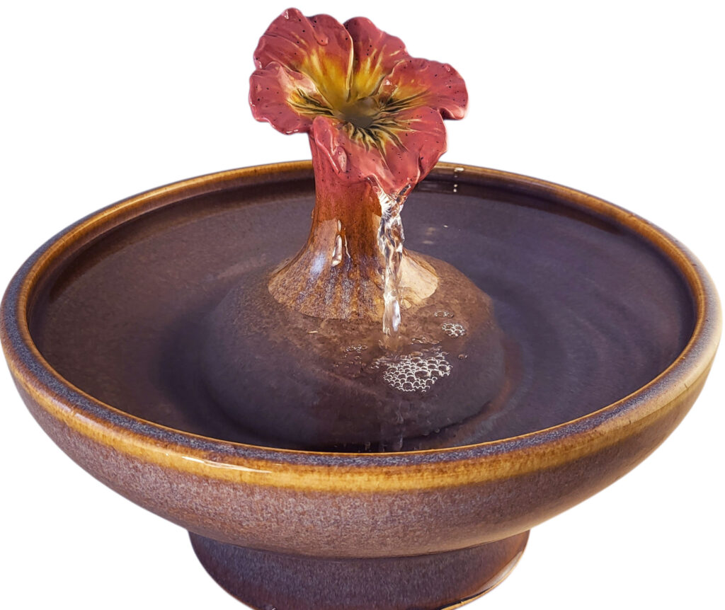 A beautiful cat water fountain with a raised drinking area for longhair ...