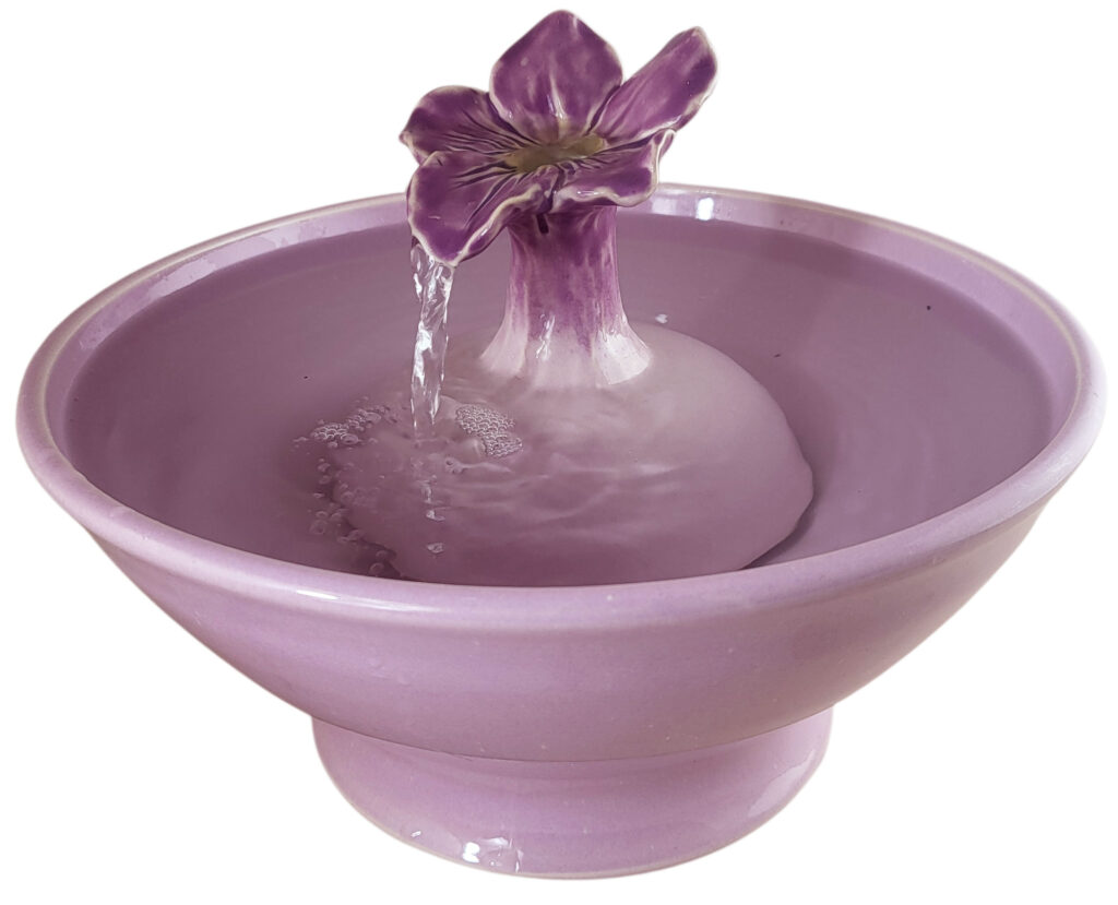 A beautiful cat water fountain with a raised drinking area for longhair ...